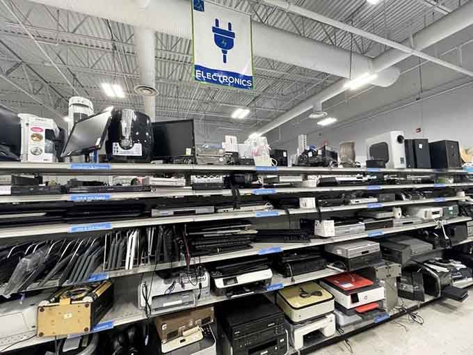 Laptops, printers, monitors stacked shelf by shelf, the electronics section looks like a tech yard sale that actually has its act together.