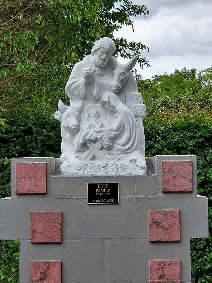 The Holy Family rendered in concrete, framed by lush greenery. Peaceful, timeless, and somehow perfectly at home in Florida.