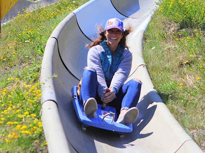 Pure joy captured mid-descent, proving that happiness is just gravity plus a hand brake.