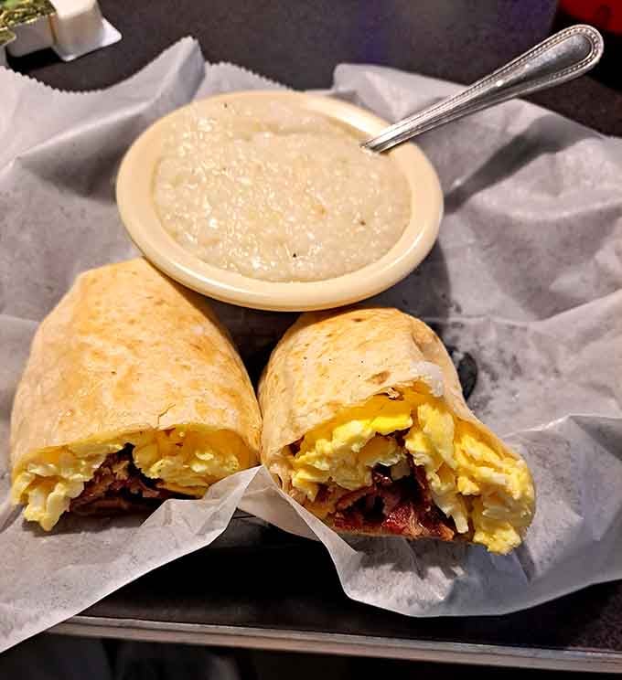 Eggs, cheese, and all the good stuff wrapped up tight, with a bowl of grits riding shotgun. Breakfast goals achieved.
