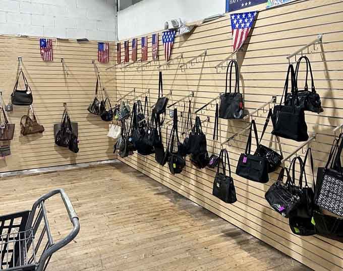 A whole wall of handbags waiting for new owners, each one with a story and a very agreeable price tag.