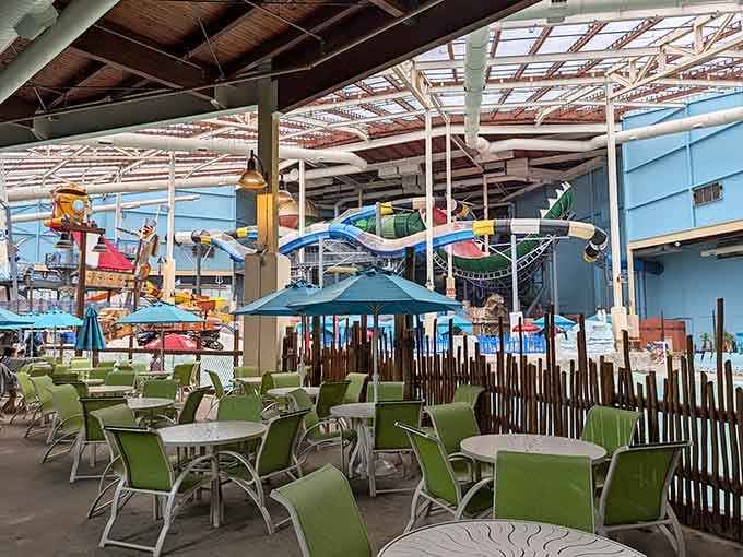 Green chairs, teal umbrellas, and water slides in the background. Honestly, worse offices exist.