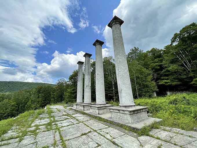 Four marble columns standing tall against a Berkshire sky, proof that some things are more magnificent in ruins than they ever were whole.