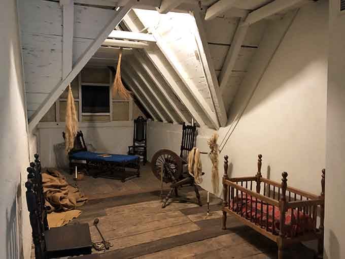 The attic holds a spinning wheel, a cradle, and enough atmosphere to keep you up at night.