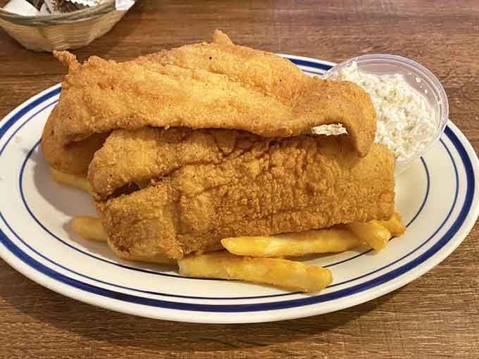Golden, crispy, and stacked high. This fried flounder means serious business, and french fries came along for the ride.