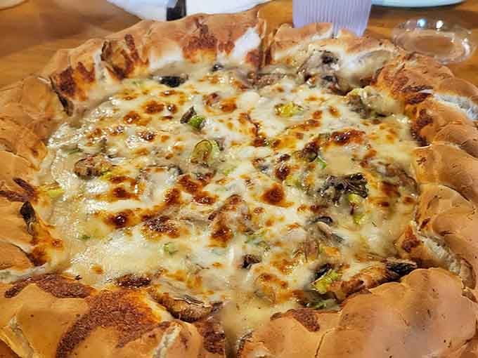 Bubbling cheese, tender chicken, and a crust so thick it practically needs its own zip code. Magnificent.