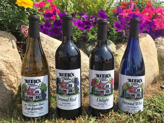 Four bottles of Bier's Inwood wine sitting in front of flowers. Michigan never looked so good in a glass.