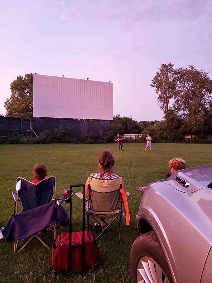 Lawn chairs, open sky, and kids playing catch before the show. Norman Rockwell would have painted this in a heartbeat.
