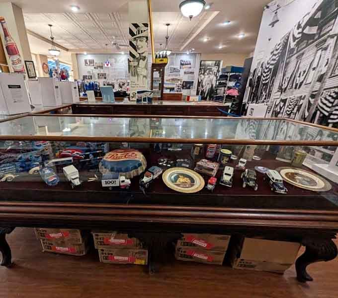 Long display cases full of old Pepsi trays, toy trucks, and collectibles that would make any memorabilia hunter very happy.