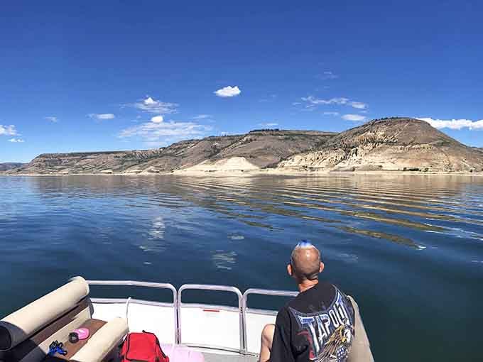 A pontoon boat, open water, and canyon scenery. This is the good life, right here.