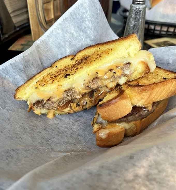 The patty melt achieves what diplomats cannot: perfect harmony between beef, cheese, and buttery griddled bread.