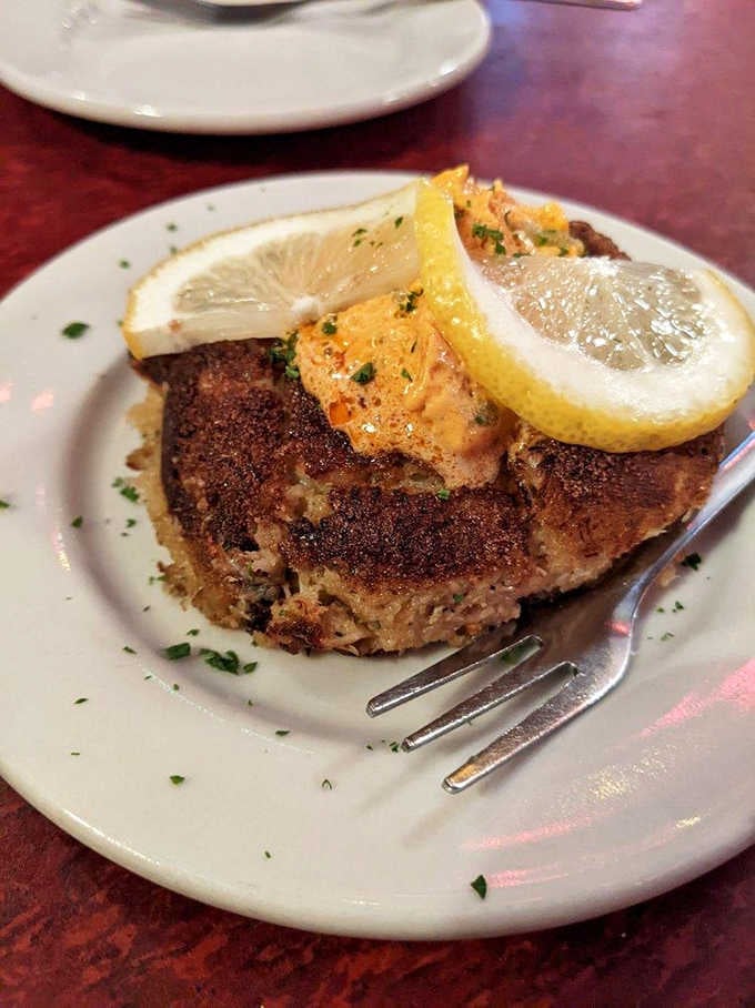 Crispy outside, tender inside, finished with lemon and that glorious butter. This crab cake is not playing around.