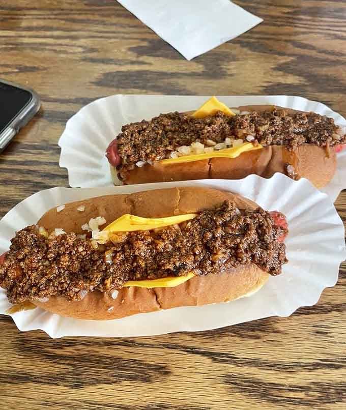 Chili cheese, and onions piled high on a hot dog that has absolutely nothing to apologize for. This is the real deal.