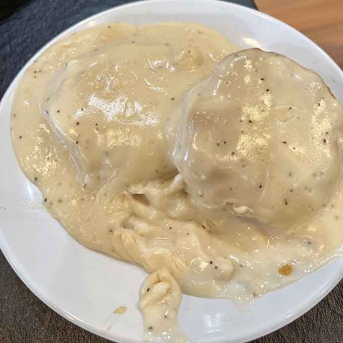 Biscuits and gravy done right, thick, peppery, and generous enough to make you forget every other version you've tried.