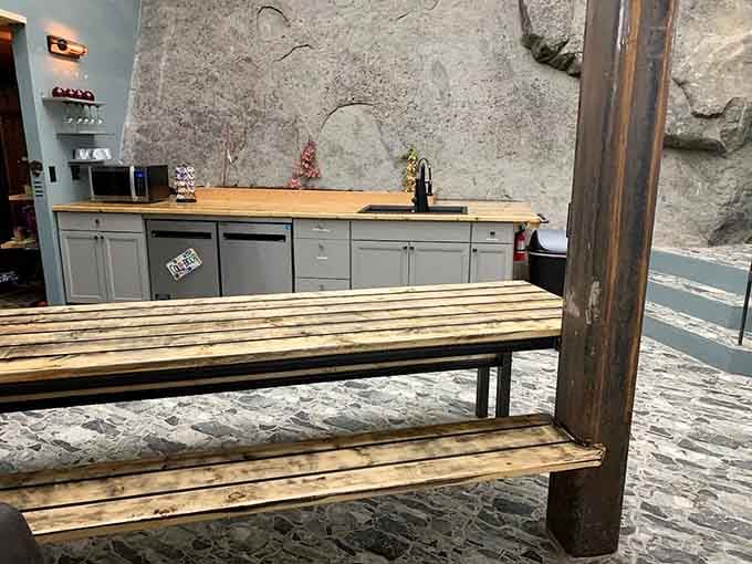 Your kitchen counter runs along genuine rock walls, making meal prep feel like an archaeological expedition.
