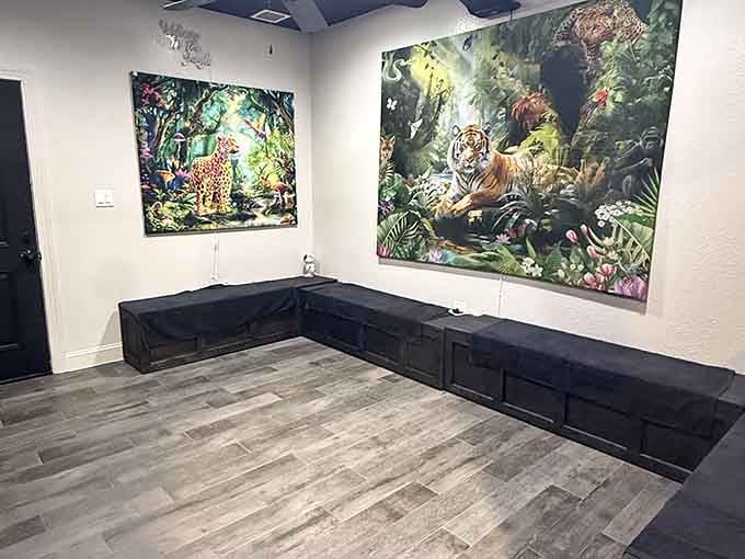 Jungle tapestries and low benches create a waiting area that feels more like an adventure than a lobby.