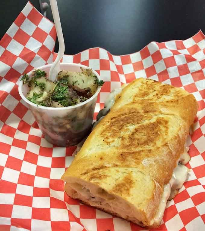 That perfectly grilled baguette and herbed potato salad side is a lunch combo worth rearranging your whole day for.