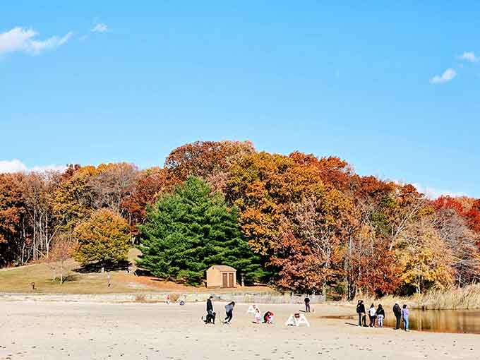 Even on a crisp autumn day, the sandy beach at Hooks Creek Lake draws a happy crowd.