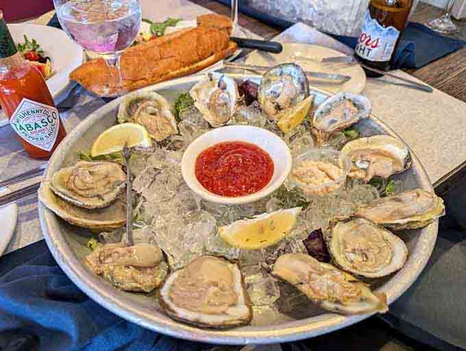 Fresh oysters on ice with cocktail sauce. The ocean called, and it wants you to eat well.
