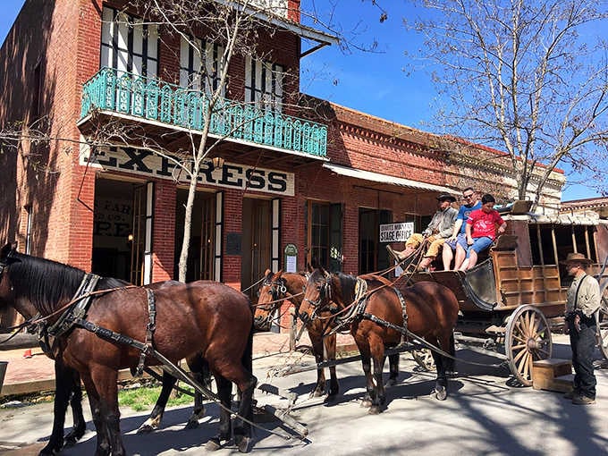 Four horses, one stagecoach, and a crowd of people suddenly wishing they'd worn period-appropriate clothing.