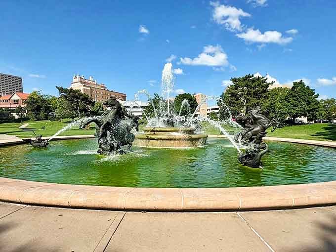 Bronze horses mid-gallop, water flying everywhere, this fountain makes every other fountain feel deeply inadequate.