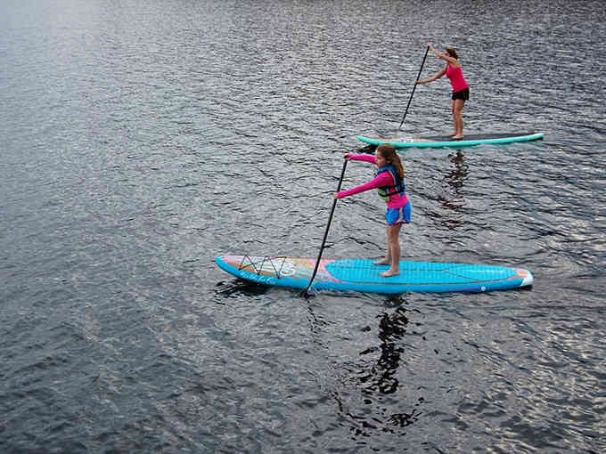 Gliding across glassy water on paddleboards beats scrolling through social media any day of the week, trust me.