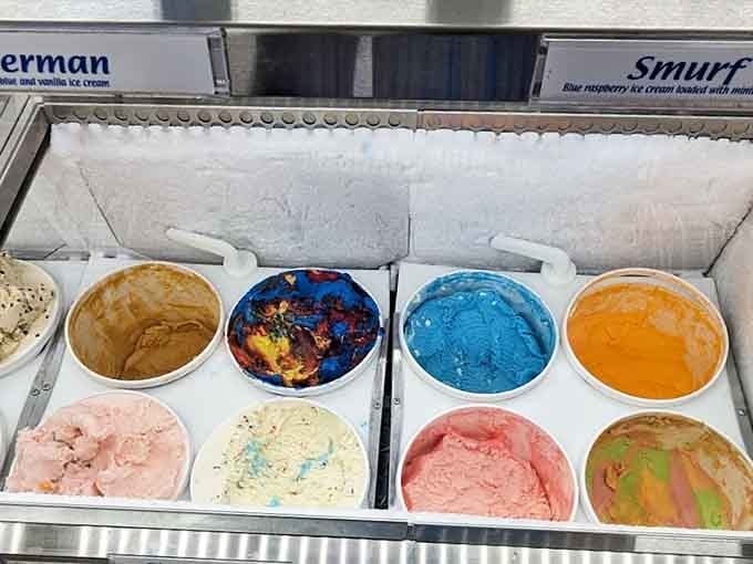 Smurf blue, swirled rainbow, and creamy peach all sitting side by side &mdash; choosing just one scoop feels almost criminal.
