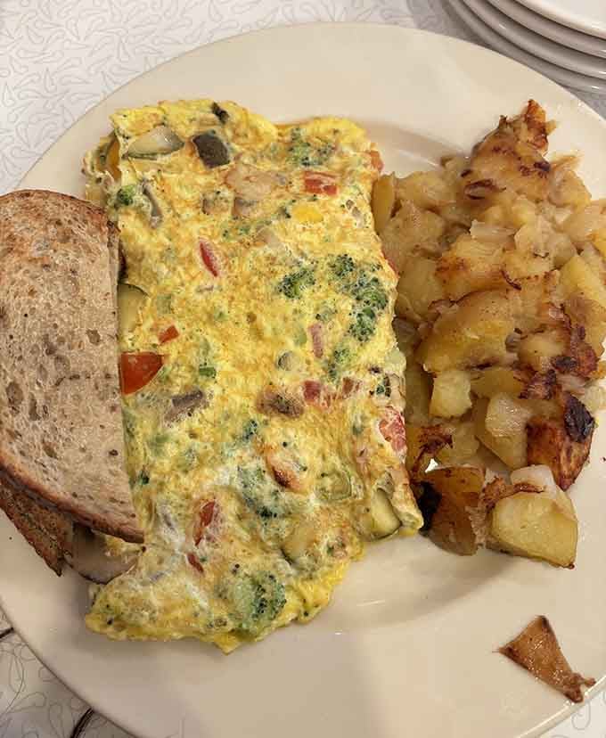 That omelette is packed with vegetables and color. Your body and your taste buds both win here.