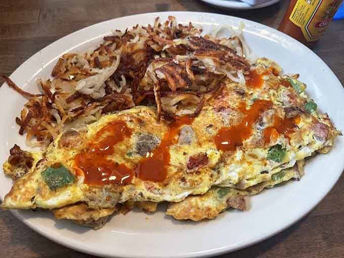 An omelette so loaded and unapologetic, it arrives like it owns the plate and knows it.