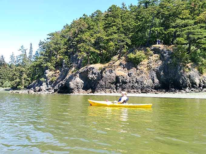Paddling past rocky cliffs at Deception Pass is the kind of afternoon you'll never forget.