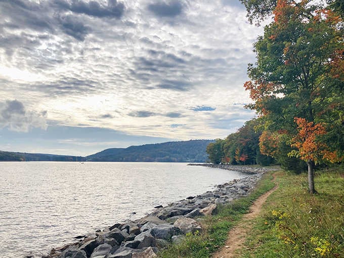 A dirt path, autumn trees, and a lake that stretches forever. Your stress doesn't stand a chance here.