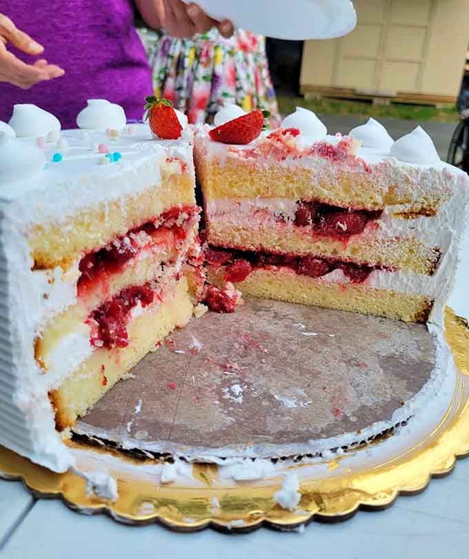 Fresh strawberries crown fluffy layers of cake that practically beg you to grab a fork immediately.