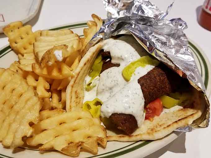 When Cincinnati chili meets Greek tradition, you get this gyro masterpiece that proves fusion food isn't always a bad idea.