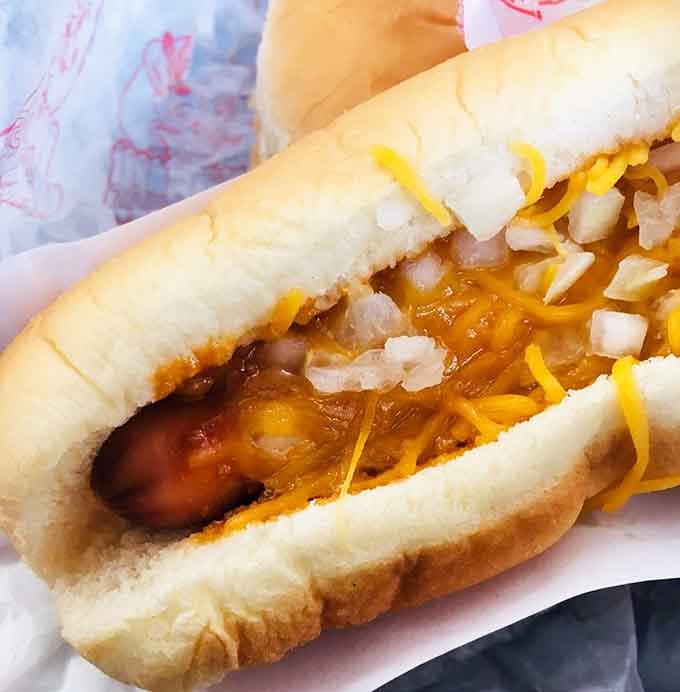 Up close, that coney sauce, shredded cheese, and diced onion situation is even more glorious than you imagined it would be.