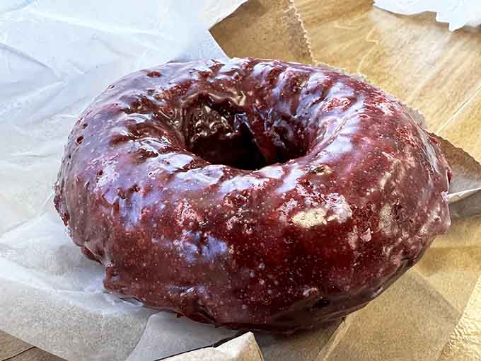That red velvet cake donut from Dom Bakeries is glossy, bold, and completely unapologetic about it.