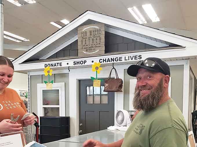 That smile says it all, friendly faces and a checkout counter that feels more like a neighborhood gathering spot.