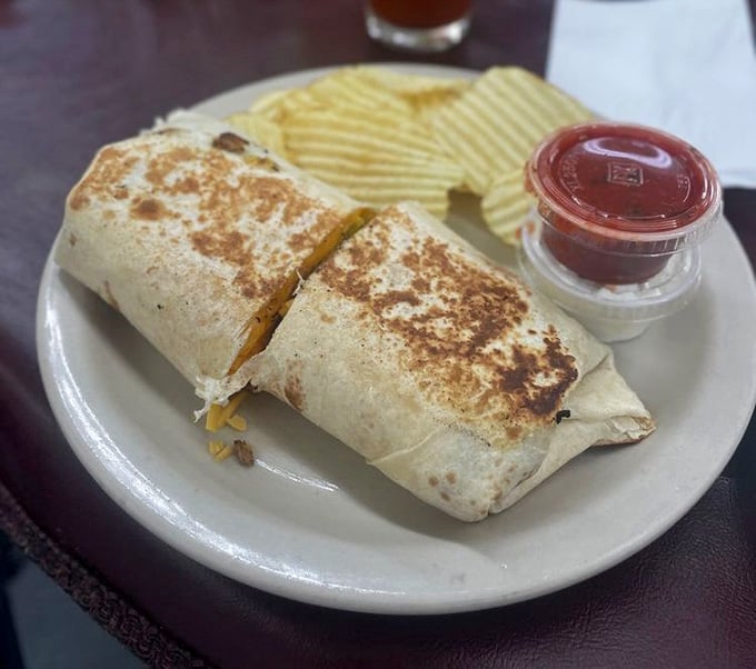 Grilled, golden, and served with chips, this burrito means business without making a fuss about it.