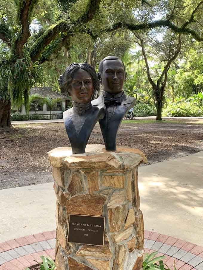 The founders of Flamingo Gardens, Floyd and Jane Wray, honored in bronze beneath a canopy of ancient oaks.