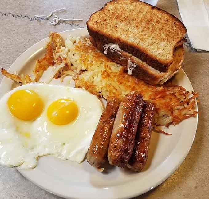Golden hash browns, perfectly cooked eggs, and sausage links that would make your grandmother proud of this plate.