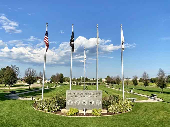 Five flags stand at attention, honoring those who served with a dignity that speaks louder than words ever could.