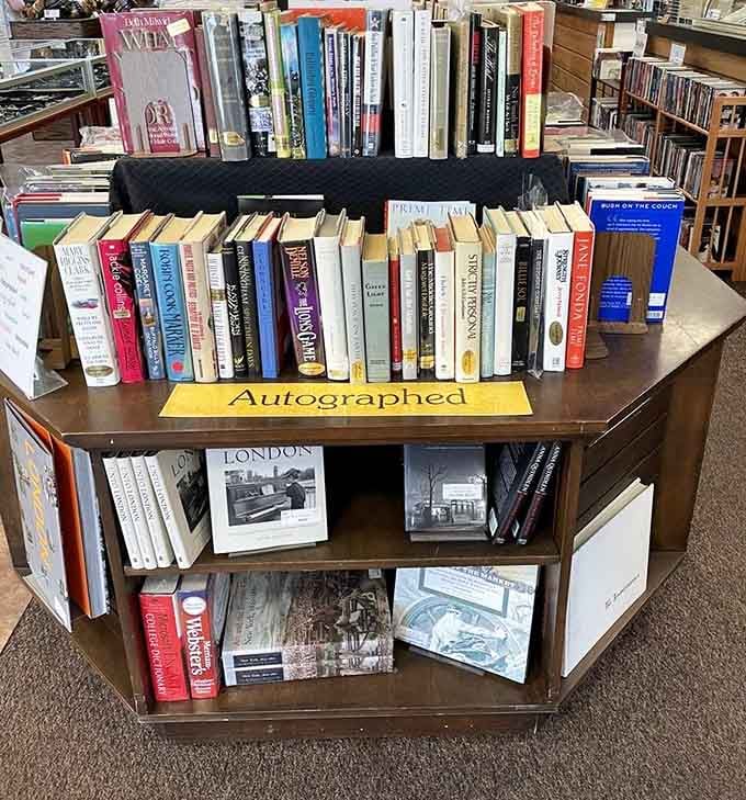 Autographed books displayed proudly on their own dedicated stand, because some books deserve a little extra spotlight.