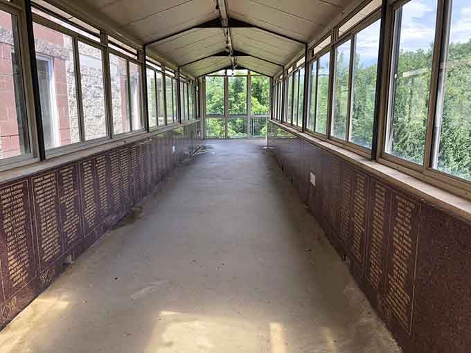 A glass-lined walkway lined with donor names tells the quiet story of a community's devotion and generosity.