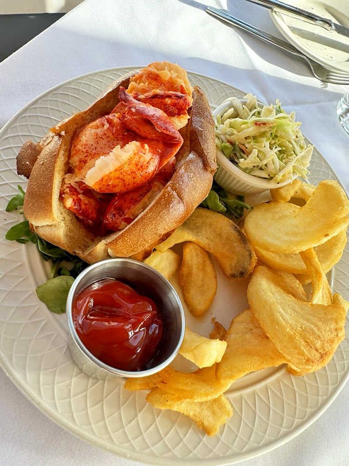 Plump lobster meat piled into a toasted roll, sidewinder fries alongside. New England just sent its very best representative.