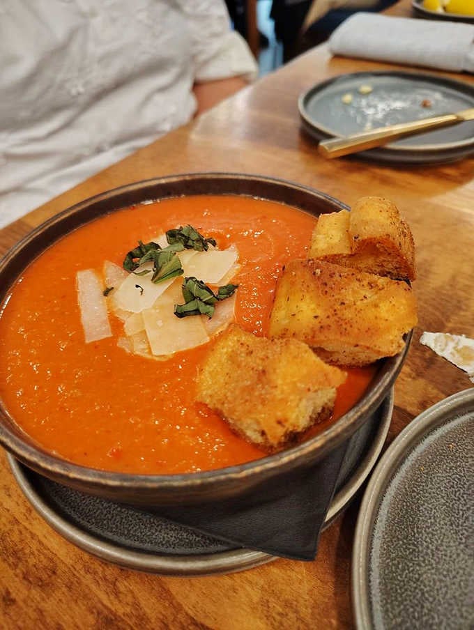 A bowl of tomato soup so rich and vibrant it makes every other tomato soup feel like it owes you an apology.