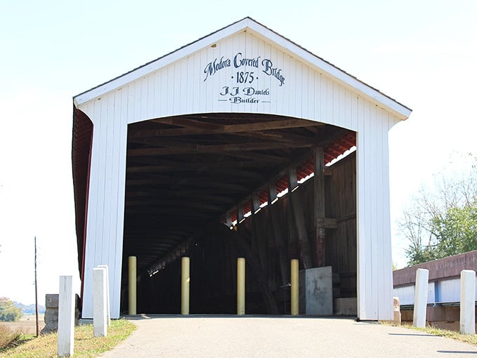 Sunlight pours through the open entrance, illuminating every weathered plank like a spotlight on a living museum.