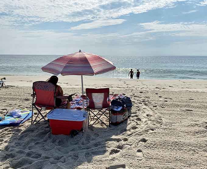 Classic beach setup with umbrella and chairs, enjoying that rare commodity called personal space and tranquility.