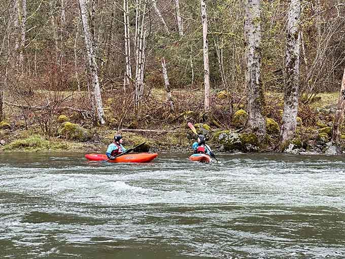 Two kayakers taking on the Green River rapids, because apparently some people find this relaxing. Respect.