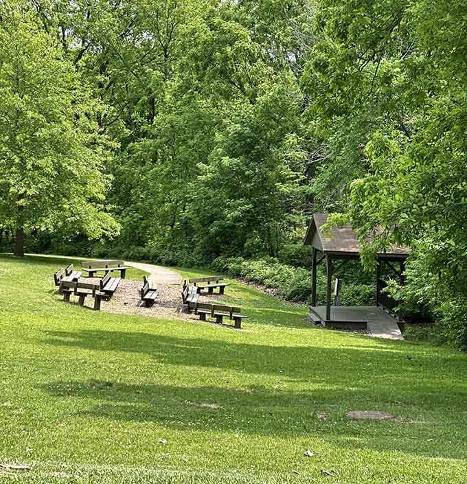 Picnic tables tucked under a canopy of summer green. Nature's own dining room, and the dress code is delightfully casual.