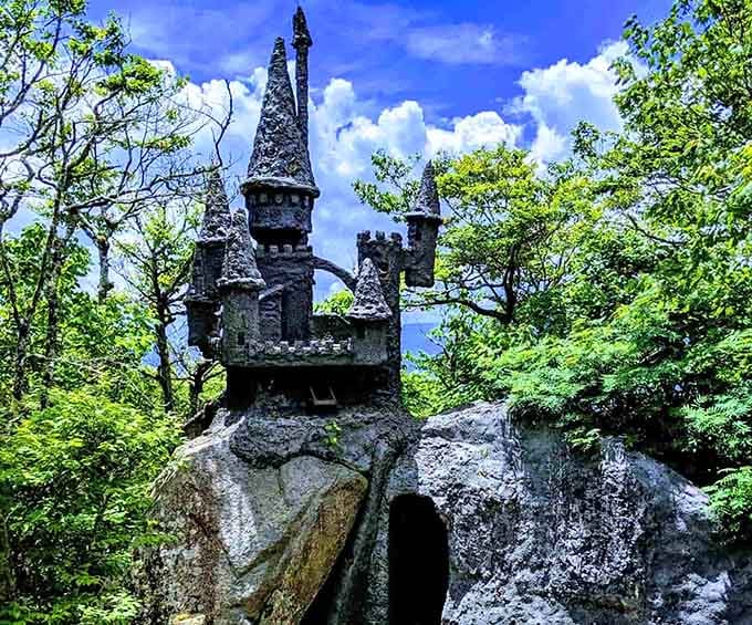 A stone castle perched on a mountain rock. Somewhere between fairy tale and fever dream, in the best possible way.