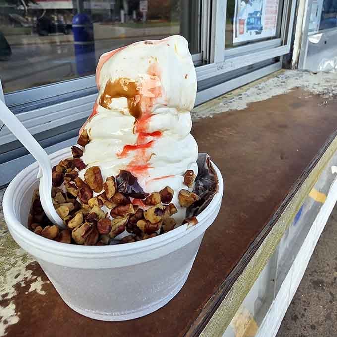 Vanilla soft serve drizzled with caramel, strawberry, and topped with nuts, simple ingredients doing extraordinary things together.